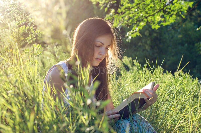 Beautiful Girl Reading a Book on a Meadow Stock Image - Image of ethnic ...