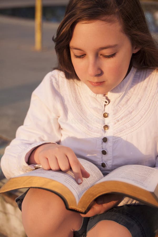 Beautiful Girl Reading Holy Bible Stock Photo - Image of sitting ...