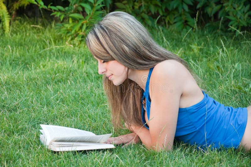 Beautiful Girl Reads the Book Stock Photo - Image of beauty, learning ...