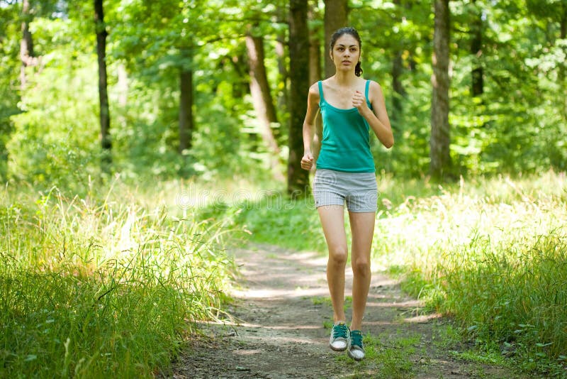 Beautiful Girl Running through Forest Stock Photo - Image of athletic ...