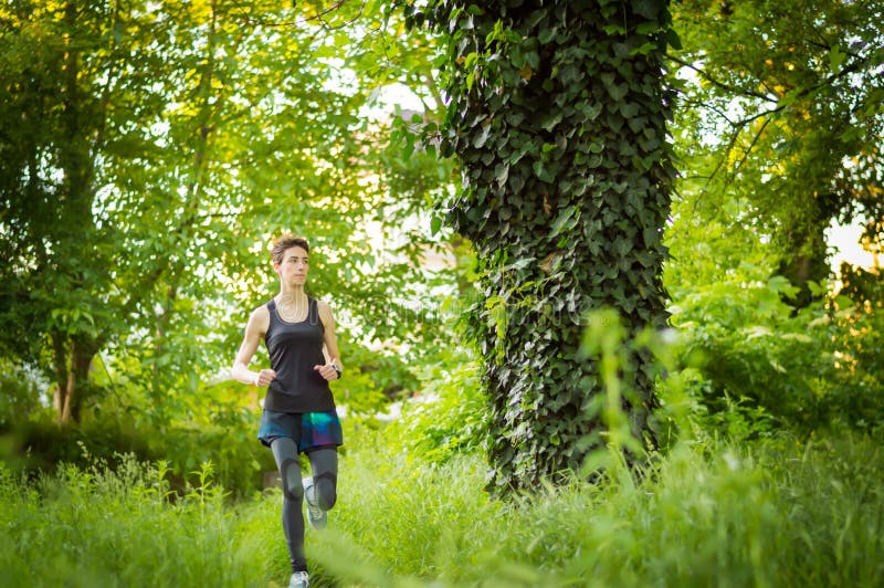 Beautiful girl running stock photo. Image of motion, forest - 92802012