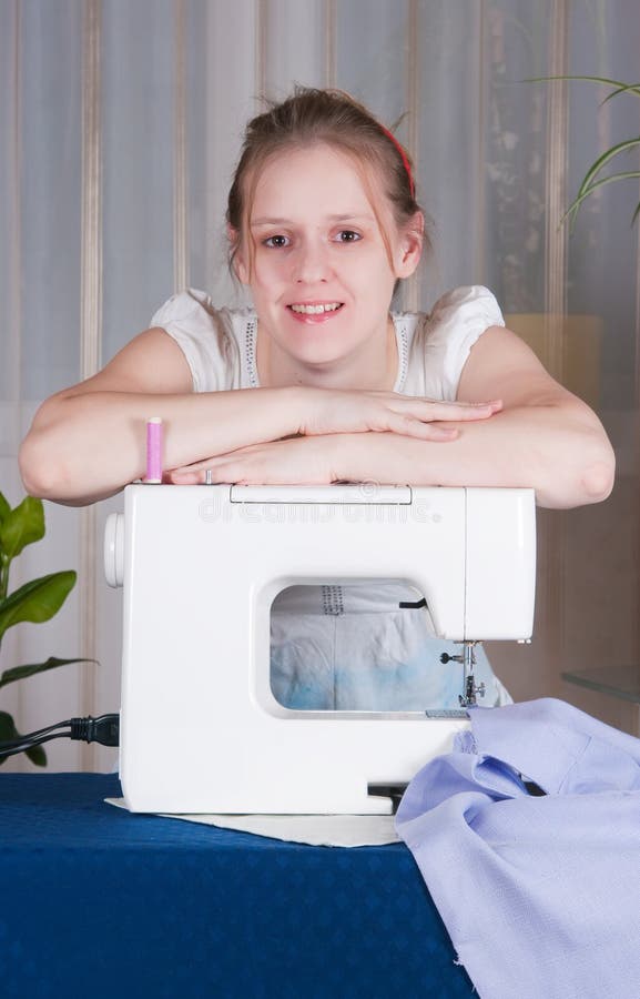 Beautiful girl sewing stock photo. Image of girl, fabric - 12185852