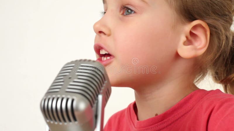 Beautiful Girl Sing Song in Microphone on White Stock Footage - Video ...