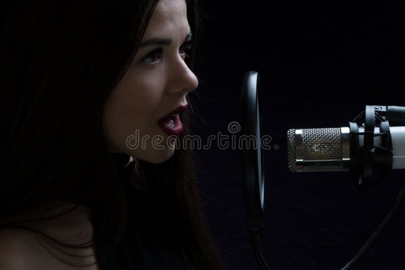 Beautiful Girl Singing in Recording Studio with Microphone Stock Image ...