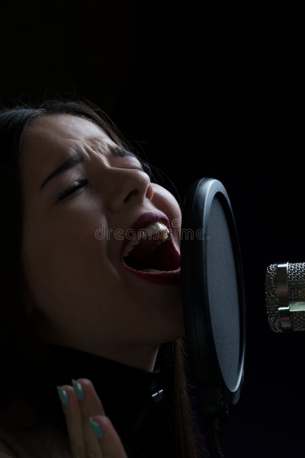 Beautiful Girl Singing in Recording Studio with Microphone Stock Image ...