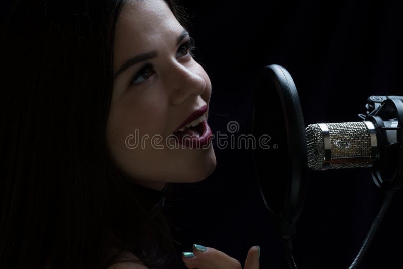 Beautiful Girl Singing in Recording Studio with Microphone Stock Photo ...