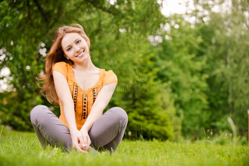 Beautiful Girl Sits on Lawn Stock Photo - Image of head, caucasian ...