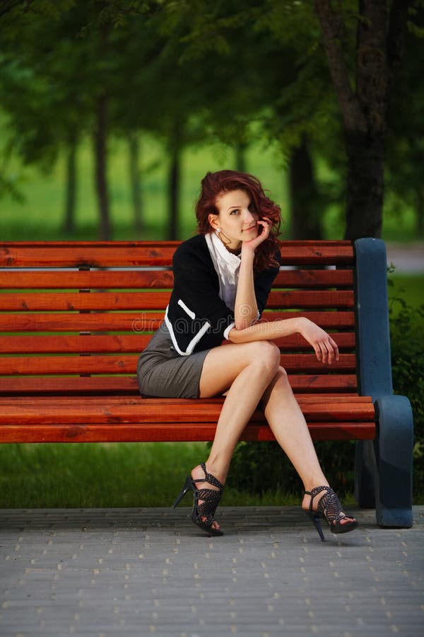 Beautiful Girl Sitting on Bench in Park Stock Photo - Image of ...