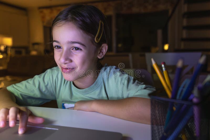 Beautiful Girl Studies at the Computer at Night. Technology and ...