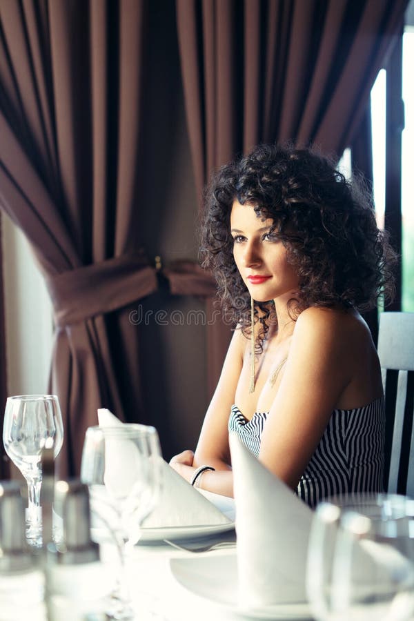 Beautiful girl at table stock photo. Image of lunch, curly - 28817826
