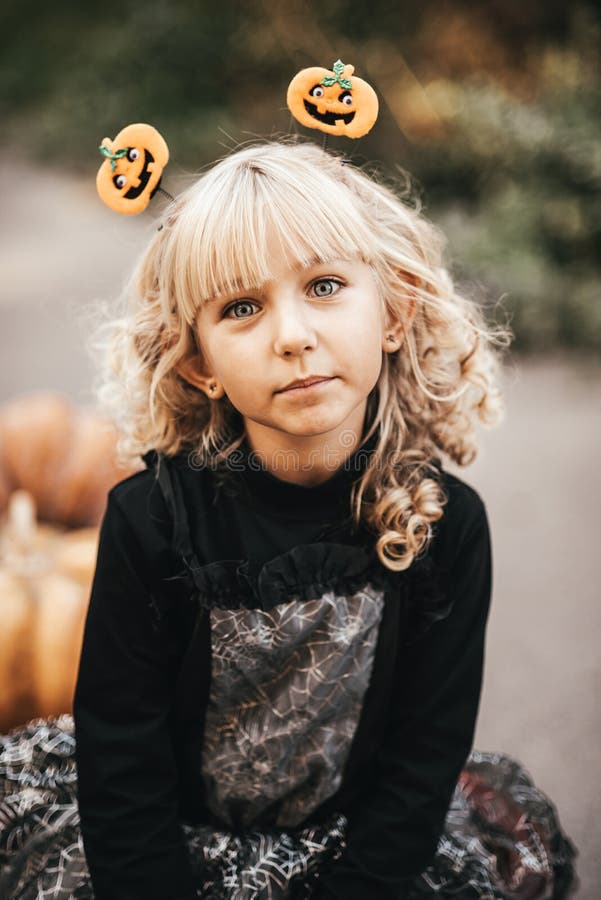 Little Girl in Witch Costume Celebrate Halloween Outdoor and Have Fun ... Little Girl in Witch Costume Celebrate Halloween Outdoor and Have Fun ...