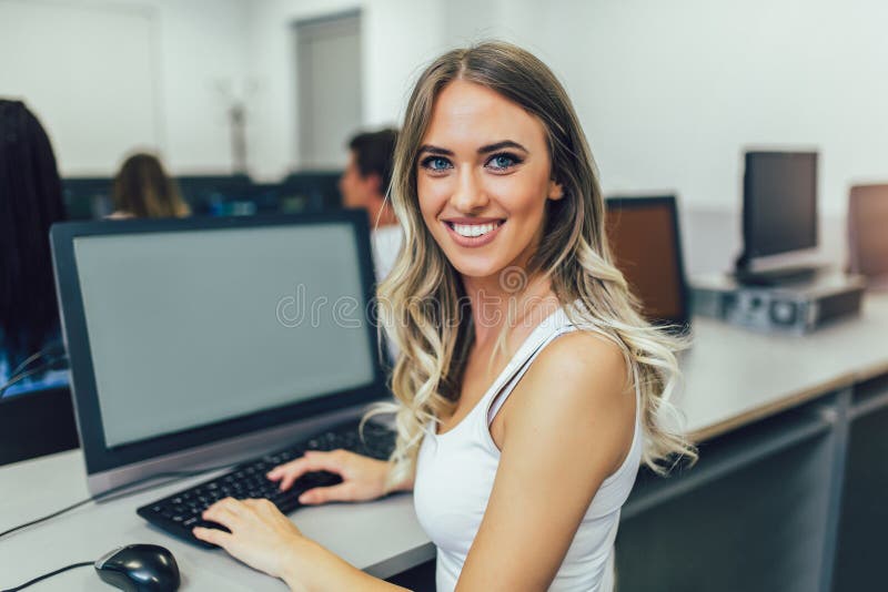 Beautiful Girl Working on a Computer in a Classroom Stock Photo - Image ...