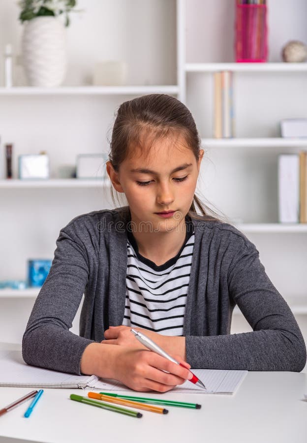 Beautiful Girl Working on Her School Project at Home. Stock Photo ...