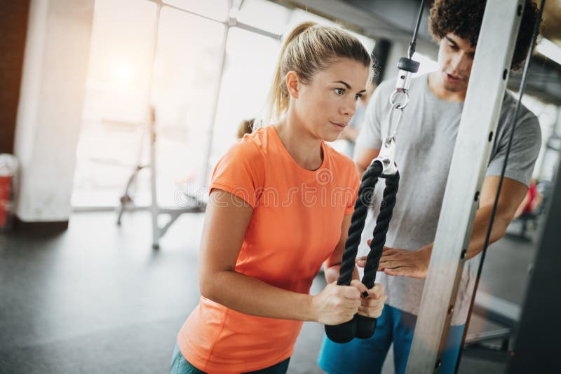 Beautiful Girl Working Out with Personal Trainer Stock Image - Image of ...