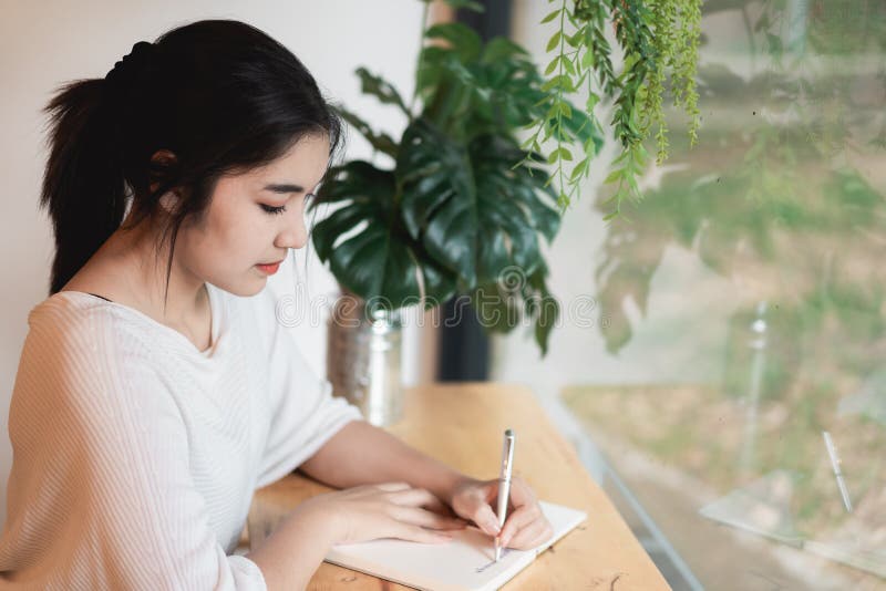 Beautiful Girl Working on the Table in the Cafe Stock Photo - Image of ...
