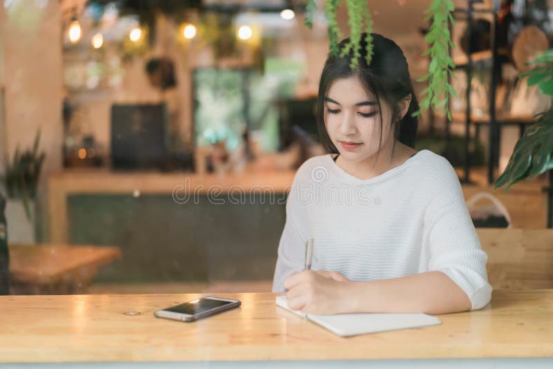 Beautiful Girl Working on the Table in the Cafe Stock Image - Image of ...