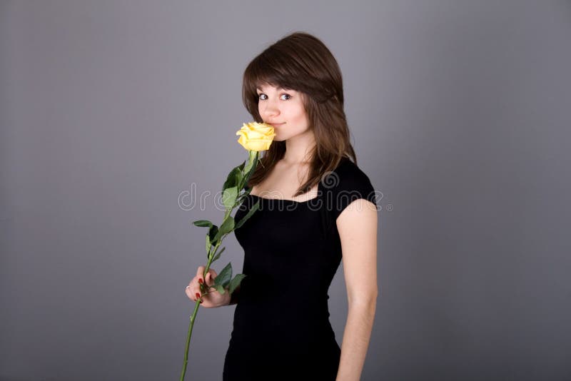 Beautiful Girl with Yellow Rose Stock Photo - Image of black, gesture ...