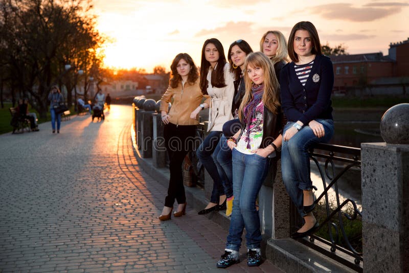 Beautiful girls at sunset stock photo. Image of riverside - 25752800