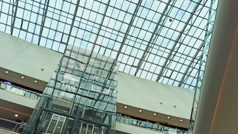 Beautiful Glass Elevator of Big Shopping Mall with Blue Sky through ...
