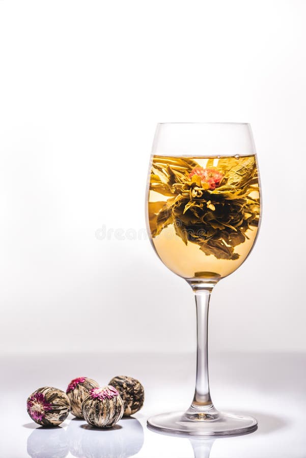 Beautiful Glass of Chinese Flowering Tea with Tea Balls Stock Photo ...