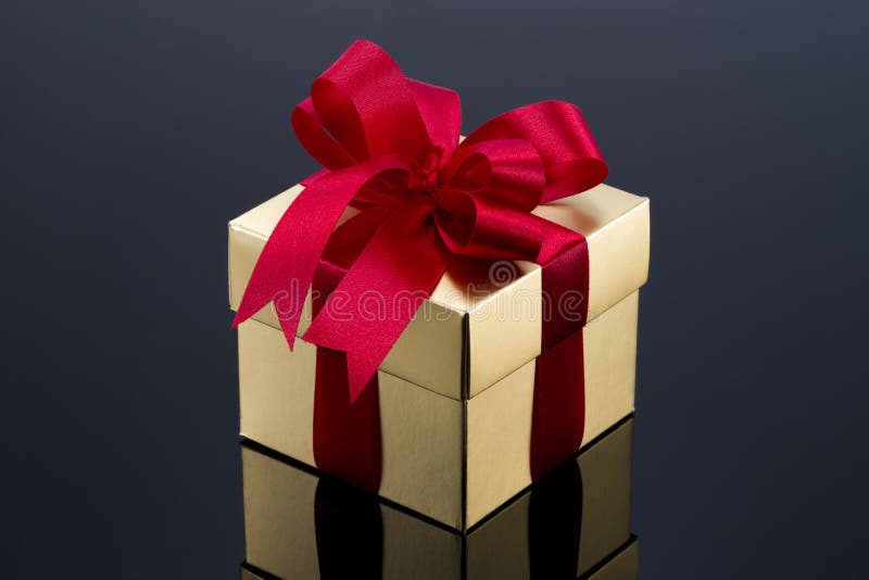 Beautiful Gold Present Box with Red Bow and Ribbons Stock Photo - Image ...