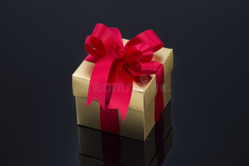 Beautiful Gold Present Box with Red Bow and Ribbons Stock Photo - Image ...