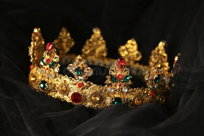 Beautiful Golden Crown with Gems on Black Cloth Stock Photo - Image of ...