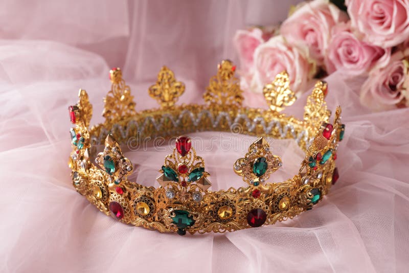 Beautiful Golden Crown with Gems on Pink Cloth Stock Photo - Image of ...