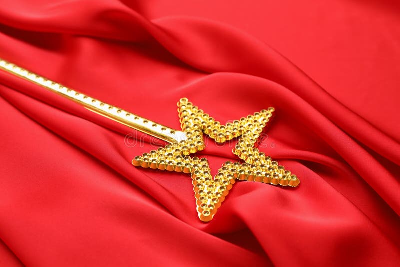 Beautiful Golden Magic Wand on Red Fabric, Closeup Stock Photo - Image ...