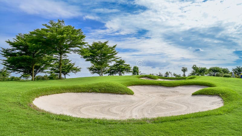A Beautiful Golf Course , Sand Bunker and Green Grass Stock Photo ...