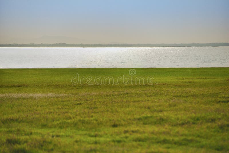 Green field and river. stock photo. Image of outdoor - 102368400
