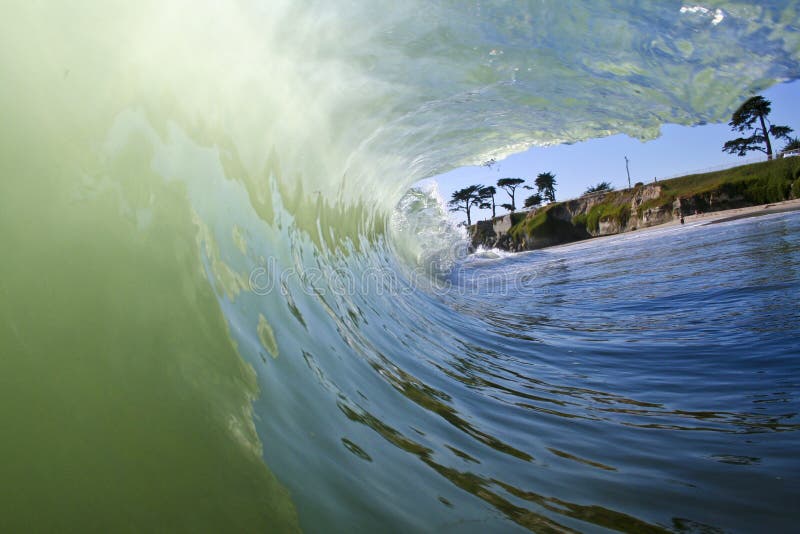Surfer on Wave at Sunset stock image. Image of barrel - 22033999