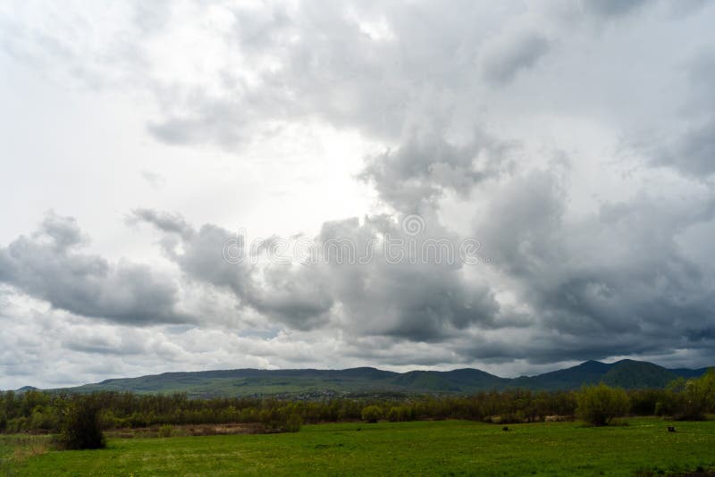 Beautiful Grey and White Clouds in Sky Over Valley Hills Stock Photo ...
