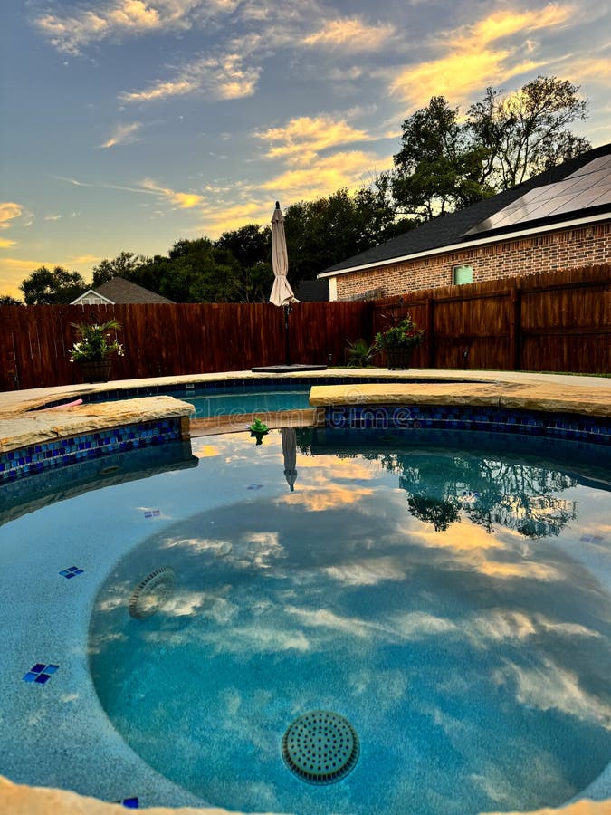 Beautiful in-ground Swimming Pool in a Residential Backyard at Sunset ...