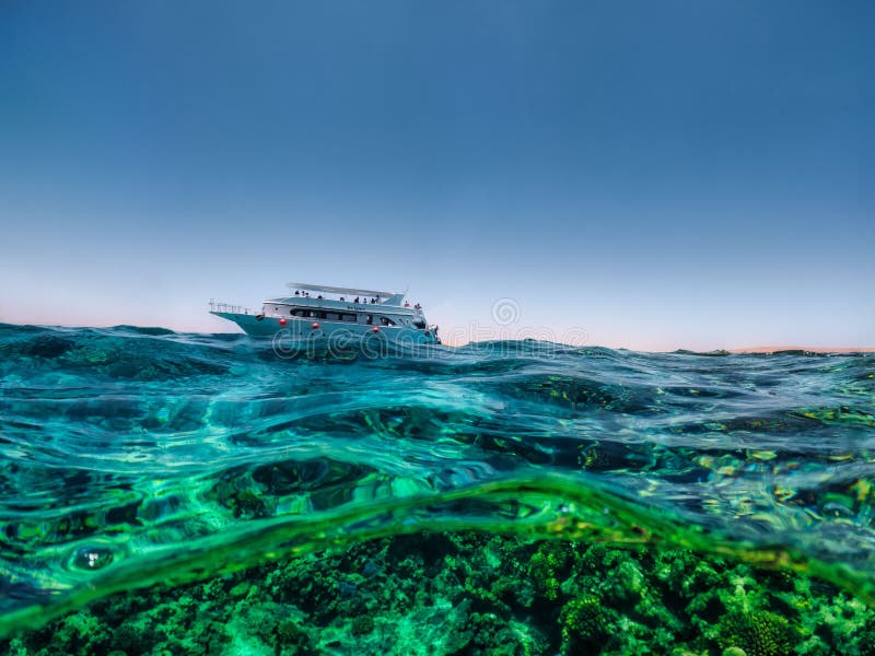 Beautiful Half-underwater Scene with a Floating Boat Against the ...