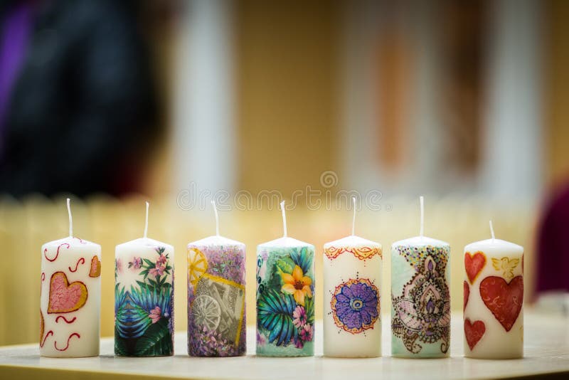 Beautiful Handmade Candles on Yellow Background. Stock Photo - Image of ...