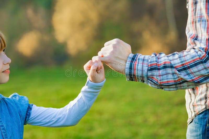 A Beautiful Hands of Parent and Child Outdoors in the Park Stock Photo ...