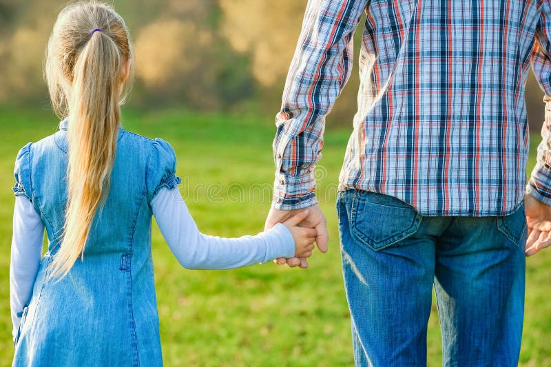 A Beautiful Hands of Parent and Child Outdoors in the Park Stock Image ...