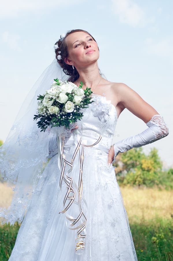 Beautiful Happy Bride Looks Down Stock Photo - Image of married ...