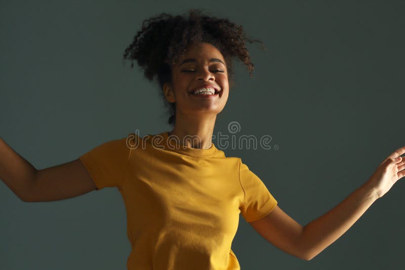Beautiful Happy Dark Skinned African American Ethnicity Woman In Yellow