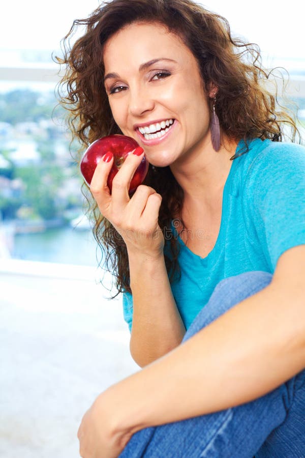 Beautiful Happy Female Eating an Apple Stock Photo - Image of beautiful ...
