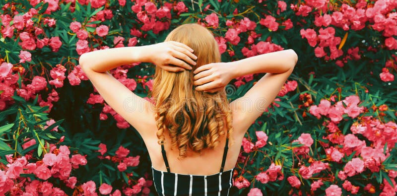 Beautiful Happy Woman Raising Her Hands Up in Garden on Roses Flowers ... Beautiful Happy Woman Raising Her Hands Up in Garden on Roses Flowers ...