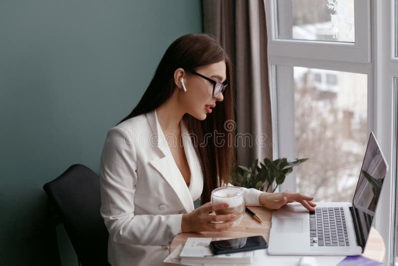 Beautiful Happy Woman Working with Laptop. Smiling Business Woman Using ...