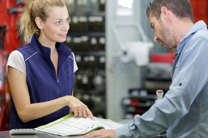 Beautiful Hardwarestore Saleswoman Helping Customer Stock Image - Image ...