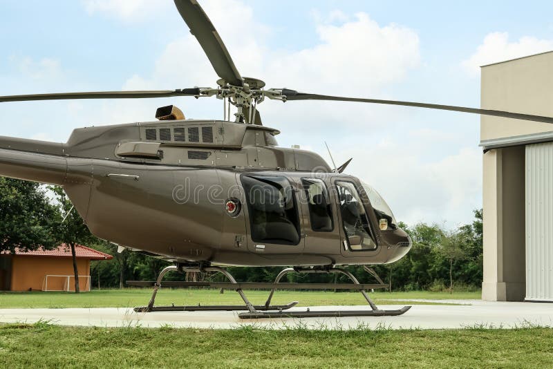 Beautiful Helicopter on Helipad Near White Hangar Stock Image - Image ...
