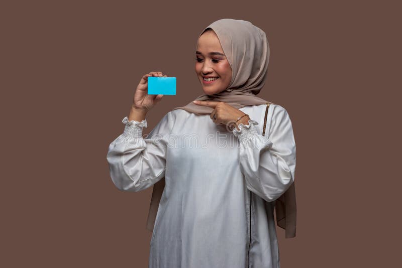 Beautiful Hijab Woman Holding and Showing Plain Credit Card, Plain ... Beautiful Hijab Woman Holding and Showing Plain Credit Card, Plain ...