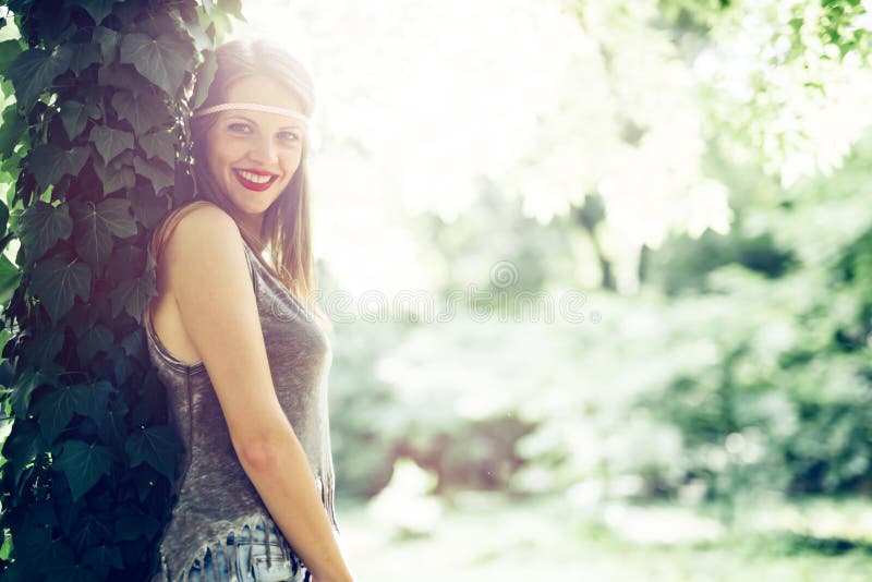 Beautiful hippie in nature stock photo. Image of grass - 133768208