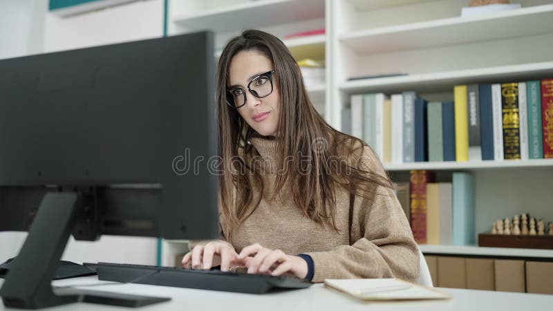 Beautiful Hispanic Woman Student Using Computer Studying at Library ...