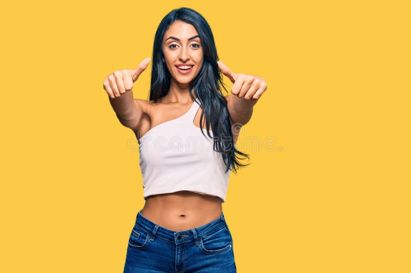 Beautiful Hispanic Woman Wearing Casual Clothes Approving Doing