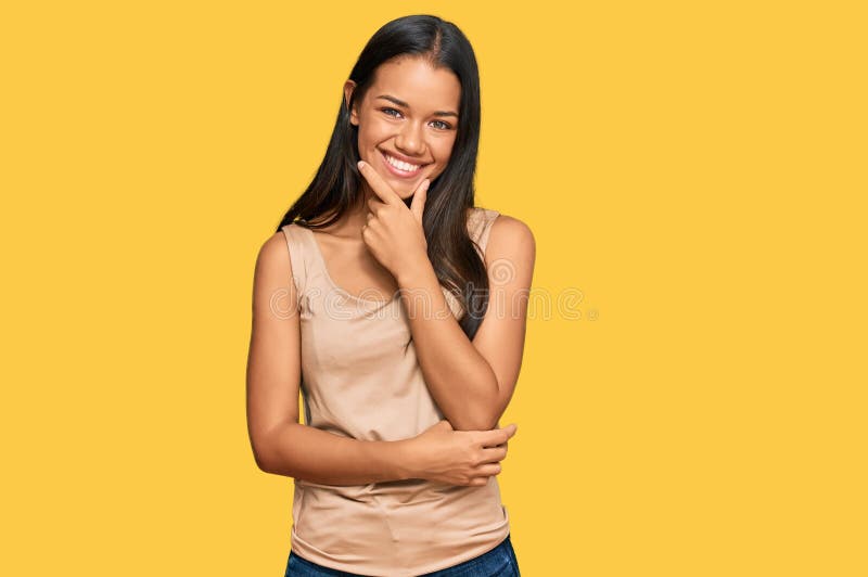Beautiful Hispanic Woman Wearing Casual Clothes Looking Confident At